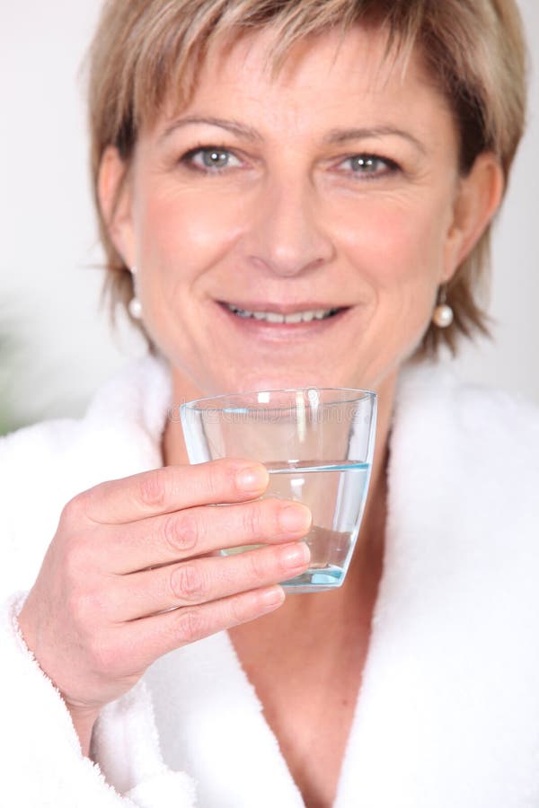 Woman drinking water stock photo. Image of calm, cozy - 23697966