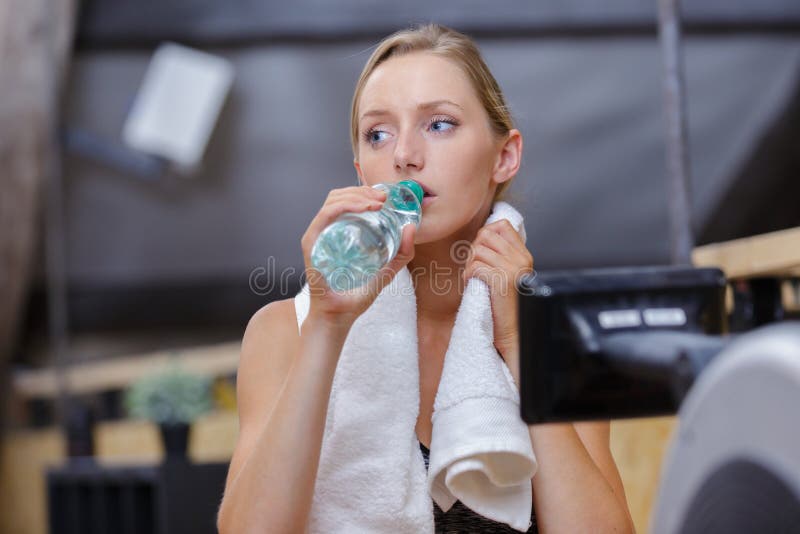 Woman Drinking Water Break from Exercise Stock Photo - Image of ...