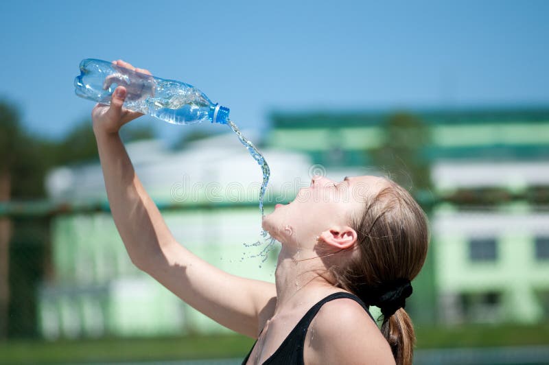 Woman Drinking Water after Exercise Stock Image - Image of hair ...