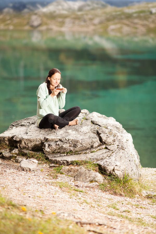 Woman drinks tea in nature stock photo. Image of life - 46046930