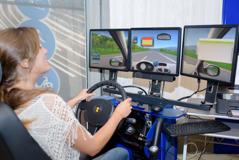 Woman in drive simulator stock image. Image of drive - 101437537