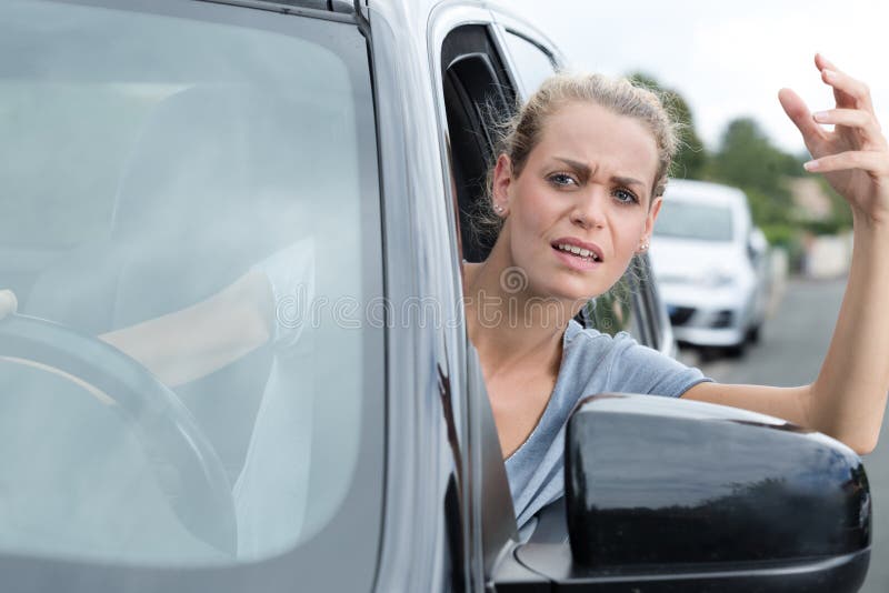Woman Driver Making Gesture through Car Window Stock Photo - Image of ...