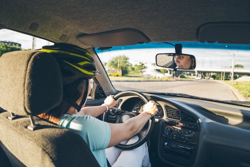 Woman Driving Car in Helmet with Horror on Her Face Stock Photo - Image ...