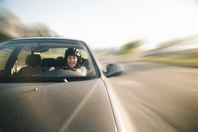 Man Driving Car in Helmet with Horror on Her Face Stock Image - Image ...