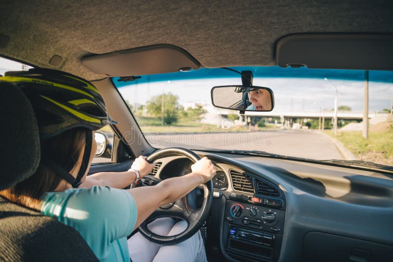 Woman Driving Car in Helmet with Horror on Her Face Stock Photo - Image ...