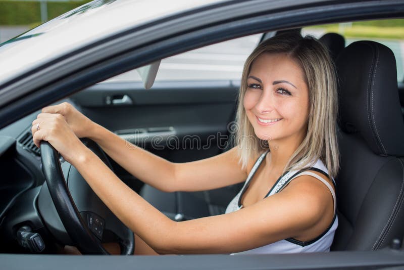 Woman driving a car stock photo. Image of person, seat - 74063520