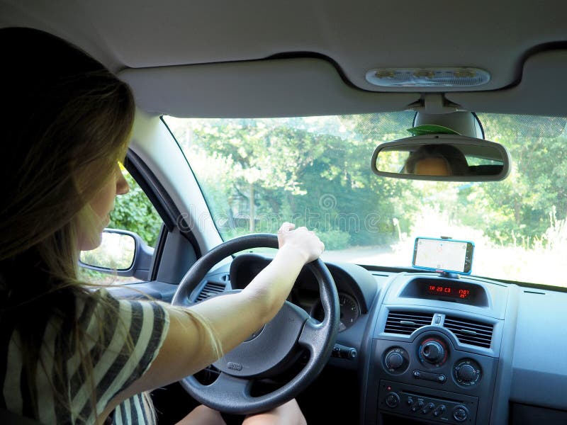 Woman Driving a Car Adjusts Rear View Mirror Stock Image - Image of ...