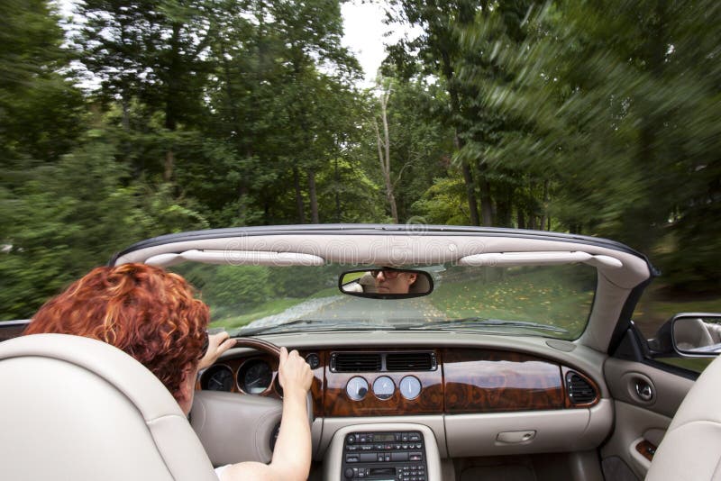Woman Driving Convertible stock image. Image of retired - 20659465