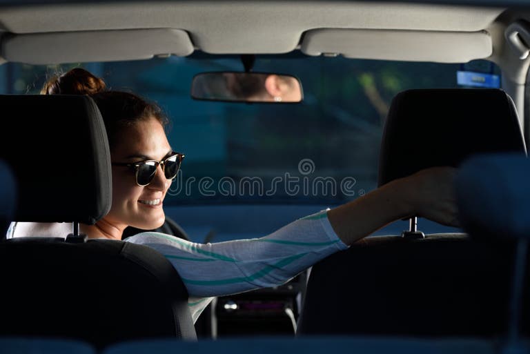 Woman driving on reverse stock photo. Image of wheel - 69632052