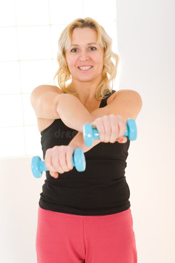 Woman with dumbbell stock photo. Image of exercise, older - 8869348