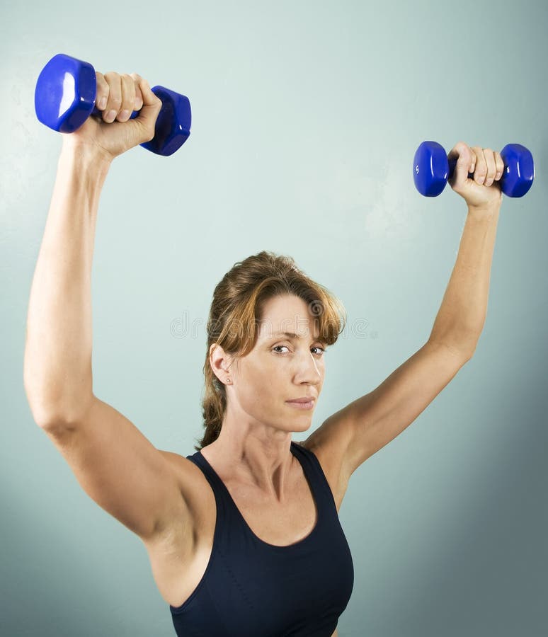Woman with Dumbbells stock photo. Image of sports, health - 5871076