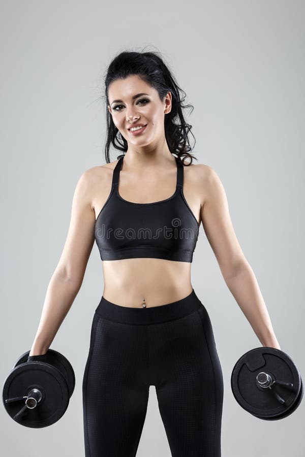 Woman with Dumbbells Doing Exercises Stock Photo - Image of muscles ...