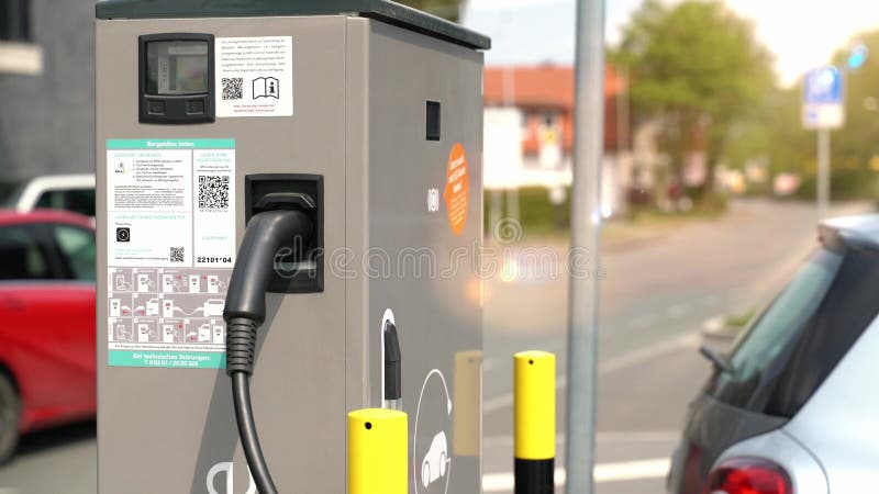 Woman at E-car Charging Public Station Plugging Type 2 Charging Cable ...