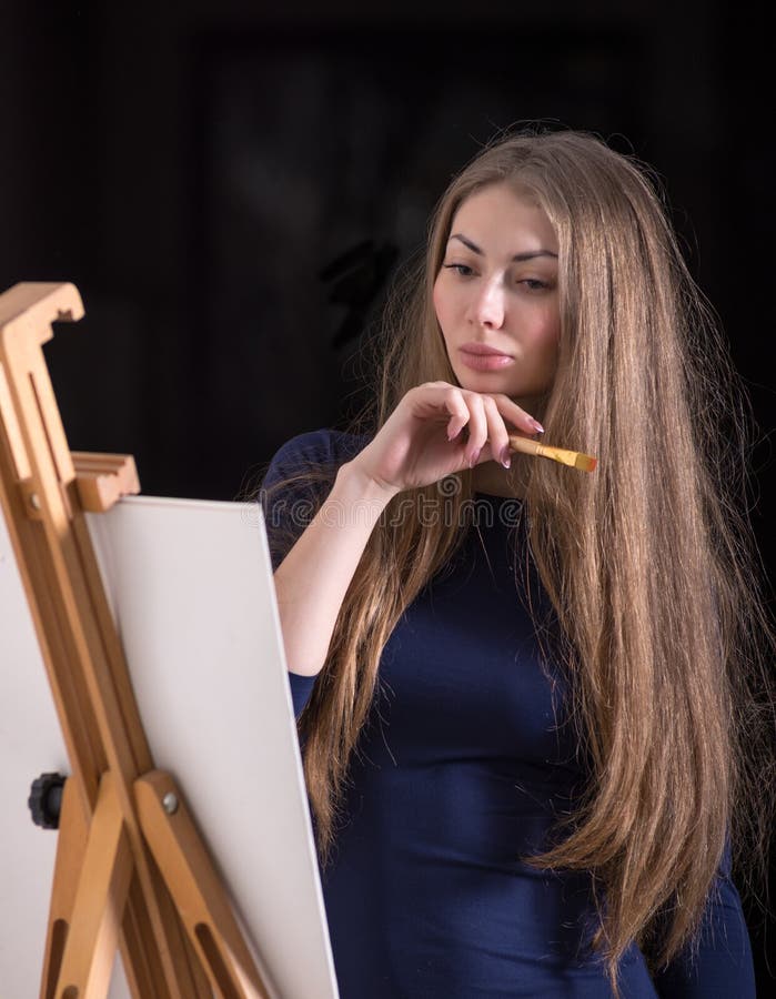 Woman and easel. stock photo. Image of studio, female - 51787024
