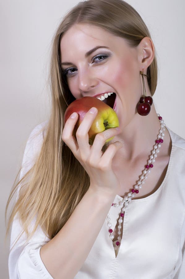Woman eat apple stock photo. Image of human, blond, lovely - 25518854