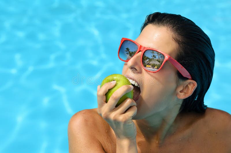 Woman Eating Apple in Pool Resort Stock Photo - Image of diet, apple ...