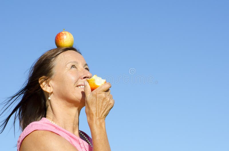 Woman eating an apple VI stock image. Image of beautiful - 23866455