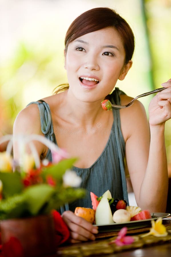 Woman Eating Breakfast stock image. Image of fruit, female - 9040049