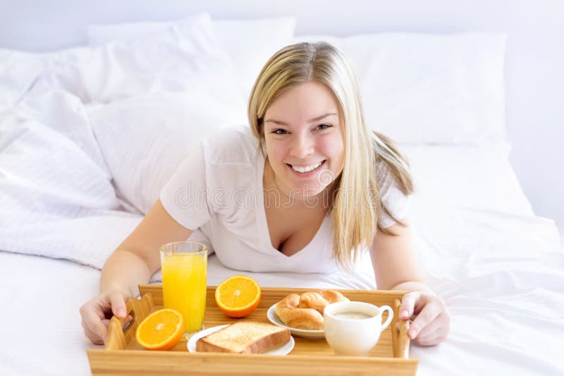Woman Eating Breakfast in Bed Stock Image - Image of happiness ...