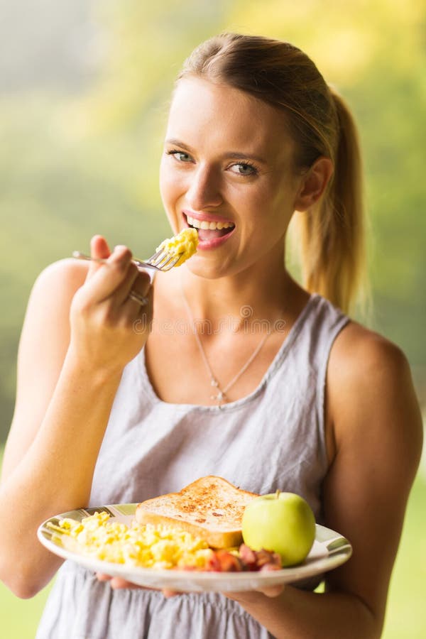 Woman eating breakfast stock photo. Image of caucasian - 50965462
