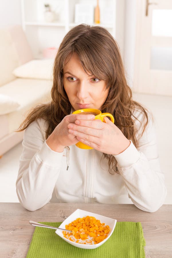 Woman Eating Breakfast at Home Stock Image - Image of hair, milk: 37611505