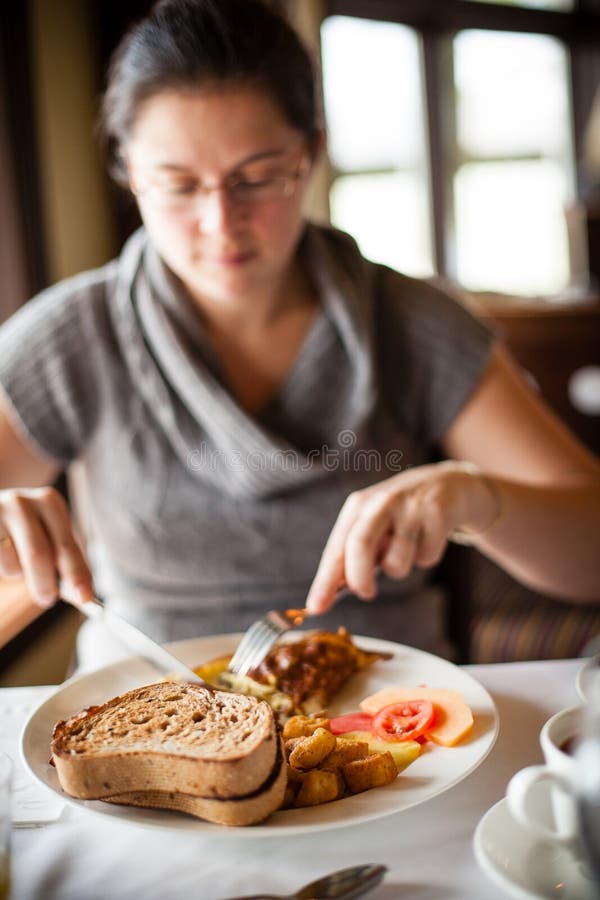 Woman eating breakfast stock image. Image of dish, healthy - 31191427