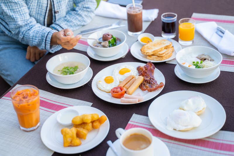 Woman is Eating Breakfast at Restaurant Stock Photo - Image of pork ...
