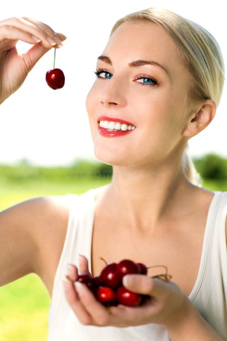 Woman eating cherries stock image. Image of close, nature - 9637119