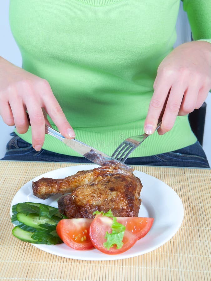 Woman eating chicken 2 stock image. Image of wood, white - 11703199