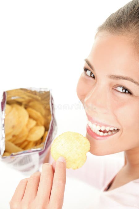 Woman eating chips stock image. Image of chip, indulgence - 15662289