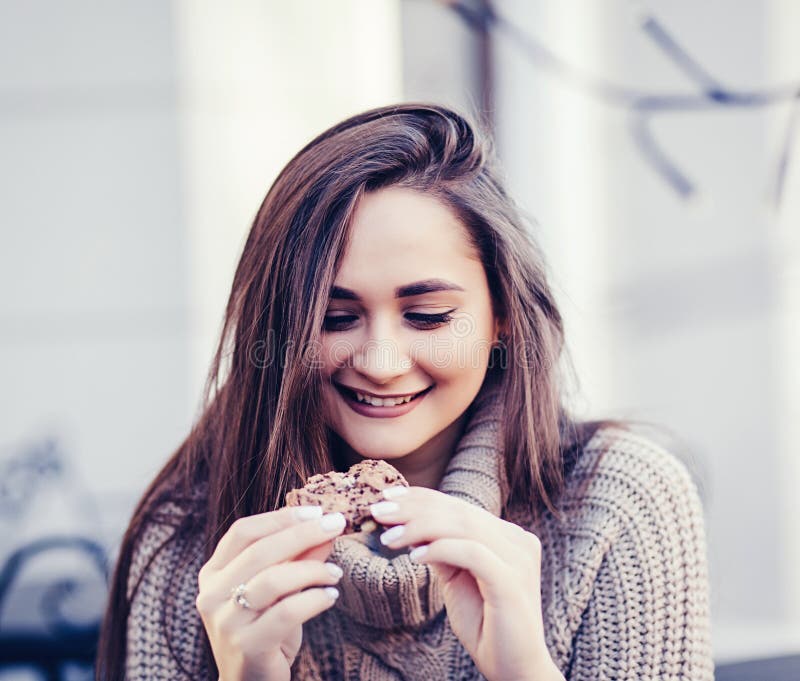 Woman eating cookie stock image. Image of peaceful, cute - 144416361