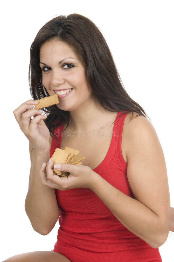 Woman eating cookies stock photo. Image of beautiful - 11534252
