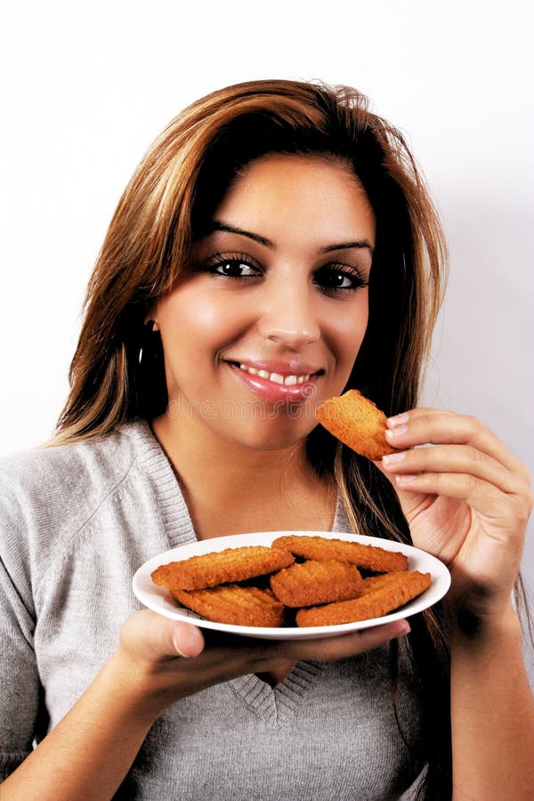Woman eating cookies stock image. Image of eyes, eats - 3893125