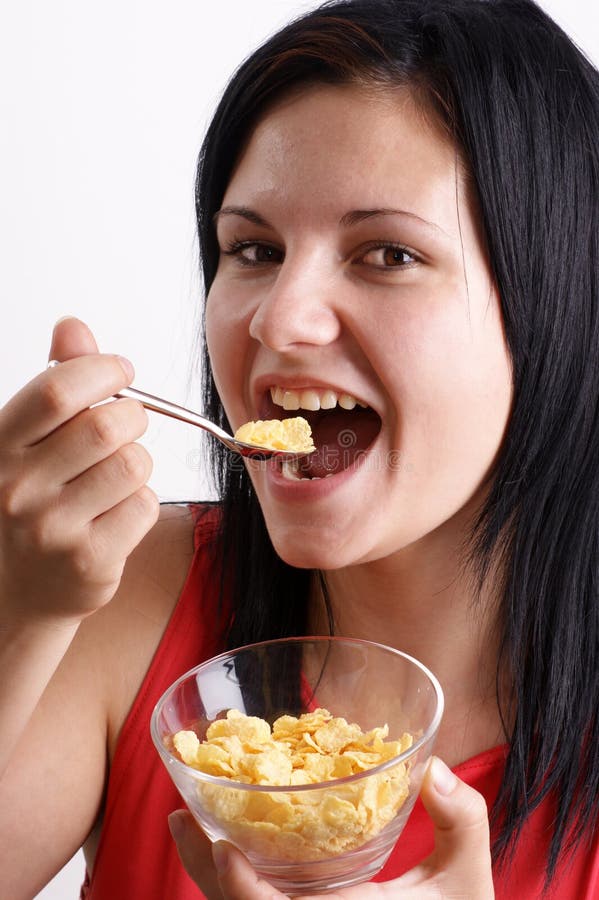 Woman Eating Corn Flakes from a Bowl Stock Photo - Image of people ...