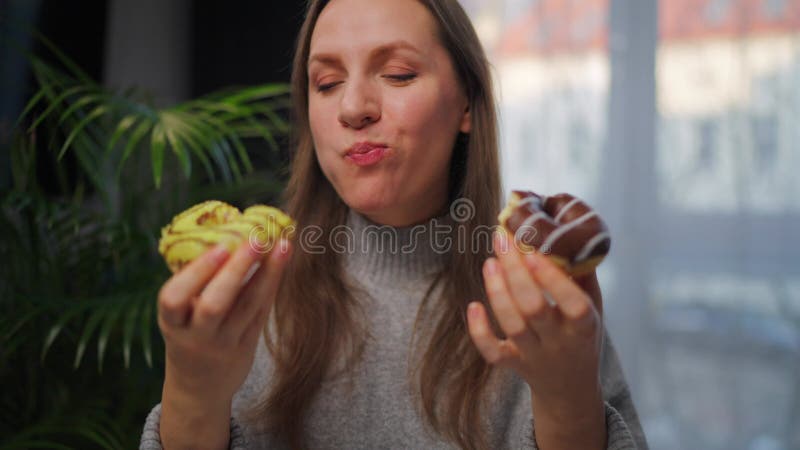 Woman with Eating Disorder Eating Two Donuts Quickly and at the Same ...