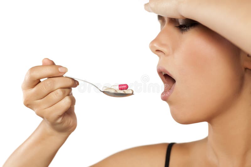 Woman eating drugs stock photo. Image of supplements - 84603798