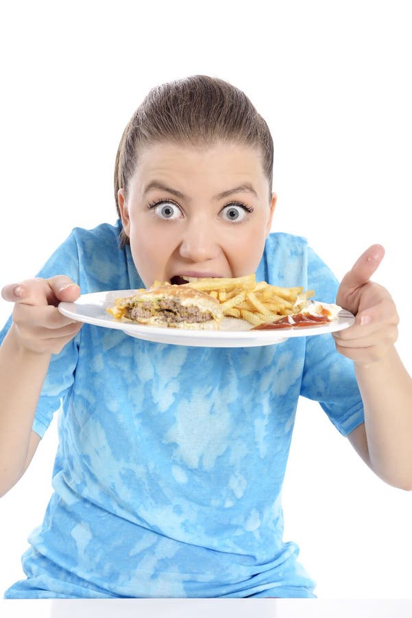 Woman eating fast food stock image. Image of beverage - 34865201