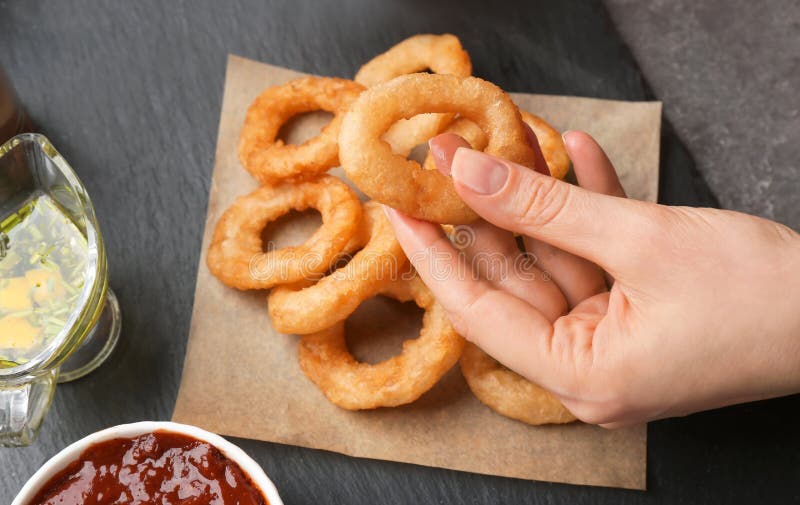 Woman Eating Fried Onion Rings with Sauce Stock Image - Image of ...