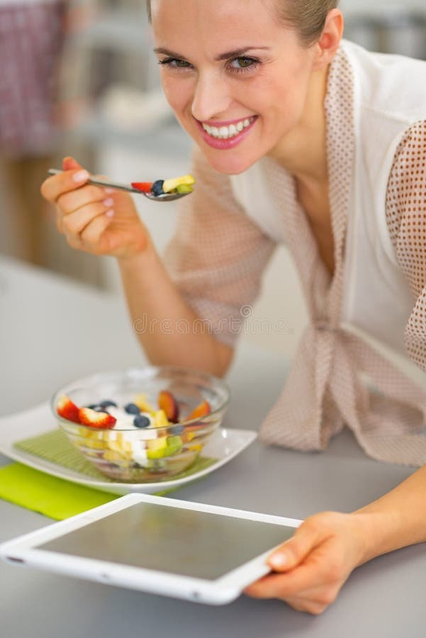 Woman Eating Fruit Salad Using Tablet Pc Stock Photos - Free & Royalty ...