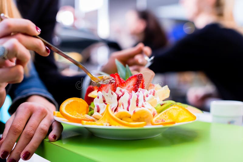 Woman Eating Fruit Sundae in Cafe Stock Photo - Image of people, woman ...