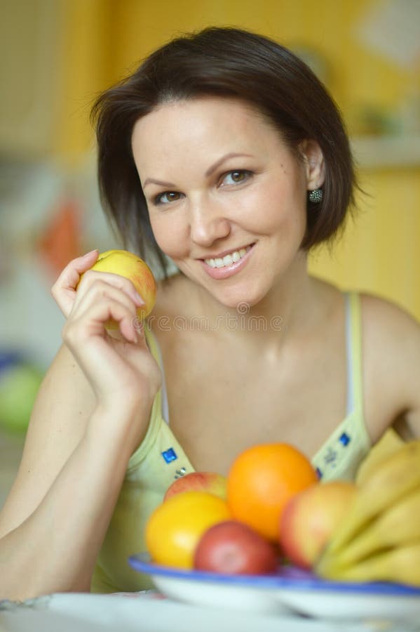 Woman eating fruits stock image. Image of fresh, banana - 42947965