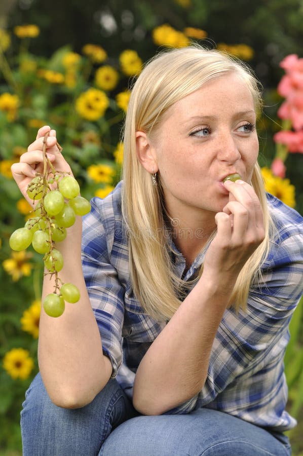 Woman eating grapes. stock photo. Image of happy, eating - 22574604
