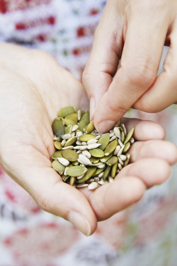 Woman Eating Handful of Healthy Seeds Stock Image - Image of seed ...