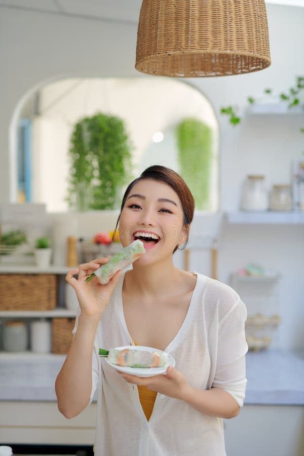 Woman Eating Healthy Spring Roll Stock Image - Image of salad, healthy ...