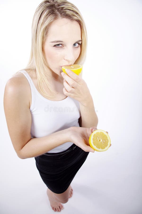 Woman eating a lemon stock image. Image of colorful, eyes - 39661819