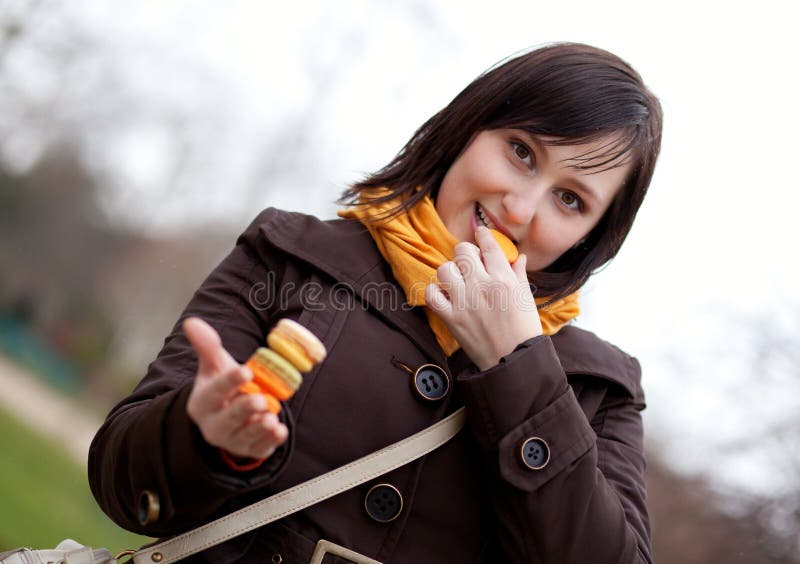 Woman eating macaroons stock image. Image of caucasian - 26211609