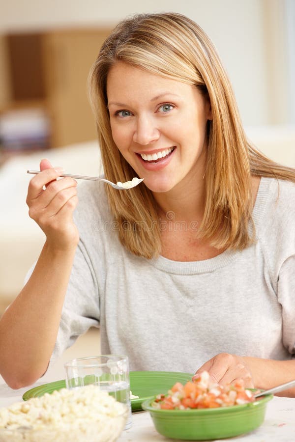 Woman eating meal stock image. Image of happy, meal, food - 55893583