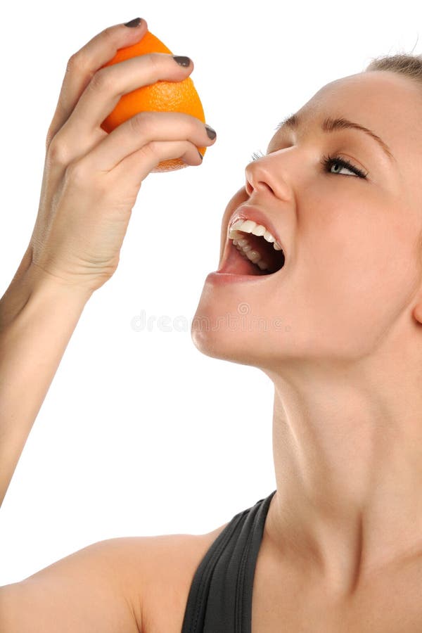 Woman Eating Orange stock image. Image of dieting, caucasian - 25459095