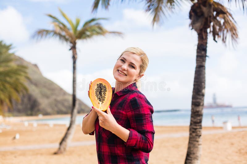Woman Eating Papaya. Woman with Fresh Fruit Papaya Outdoors. Stock ...