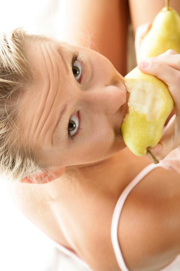 Woman eating pear stock image. Image of biting, contact - 11297149